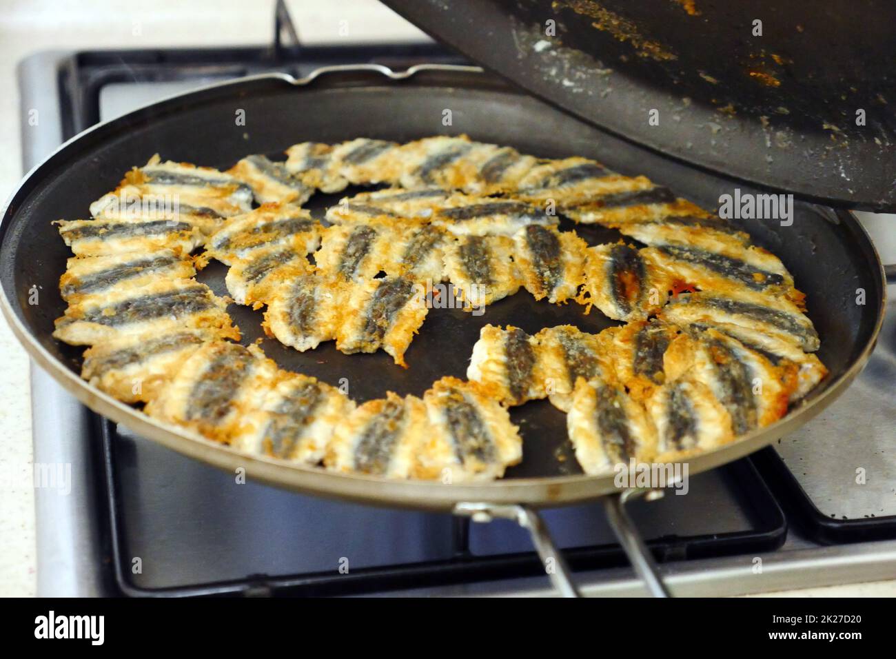 frying anchovy fish in a pan, Turkish style anchovy - pan frying ...
