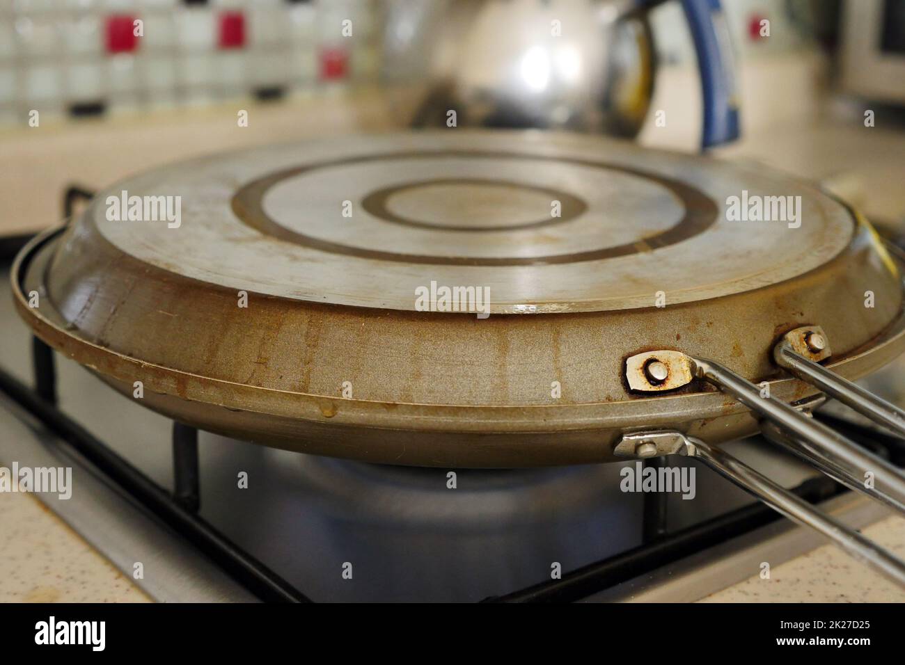 Fish are cooking in a closed fish pan, double-sided fish pan on the ...