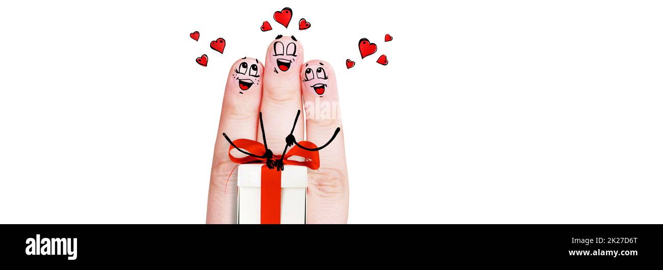 Finger puppets of loving parents with young child hugging and having ...