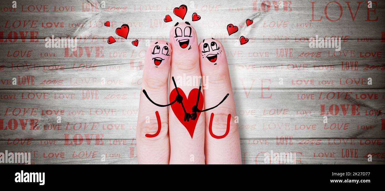 Finger puppets of loving parents with young child hugging and having ...