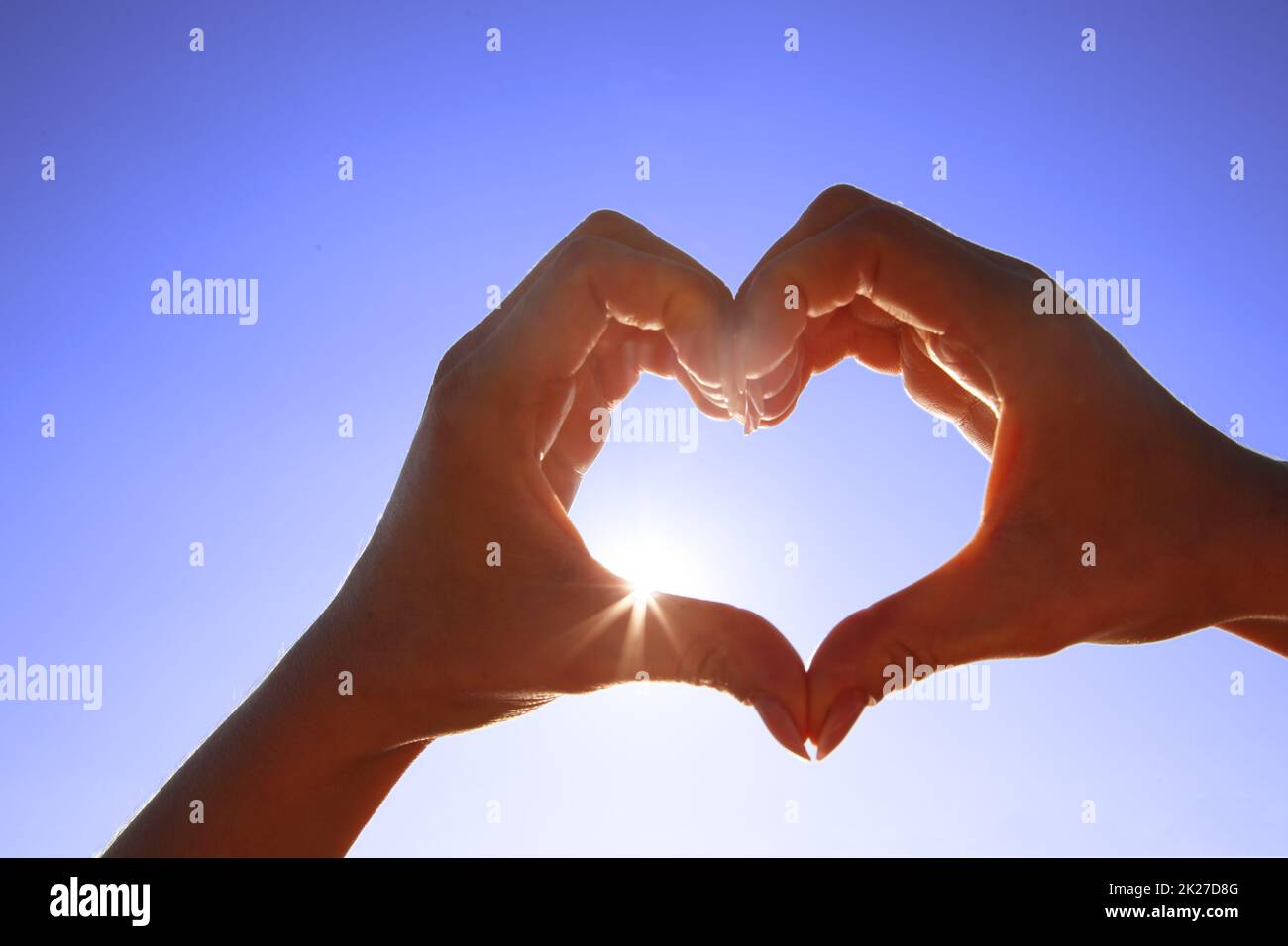 Hand shaped heart against sunset. Valentines day concept Stock Photo ...