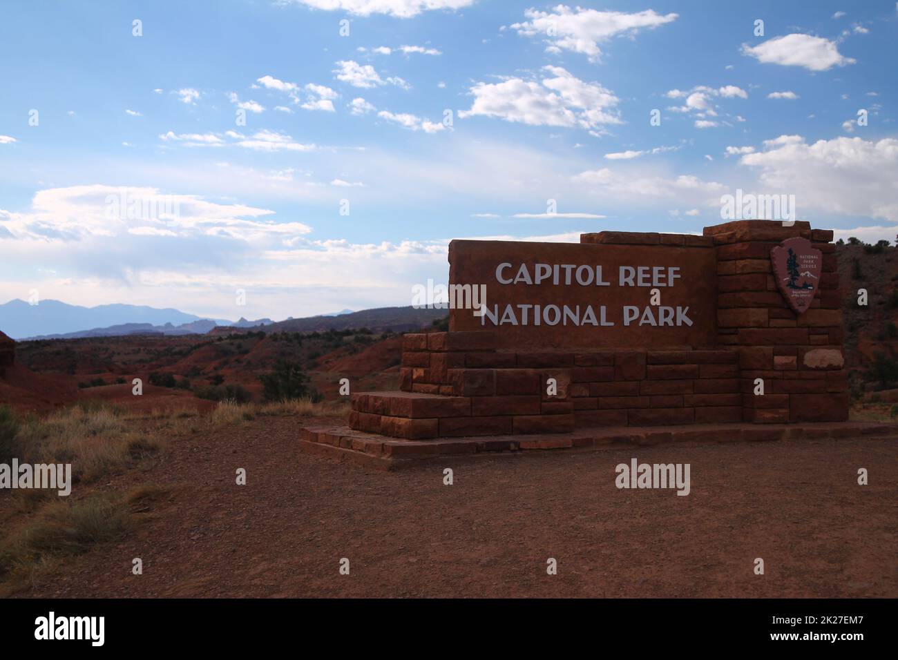 Traditional red rocks sign at the entrance of the Capitol Reef National ...