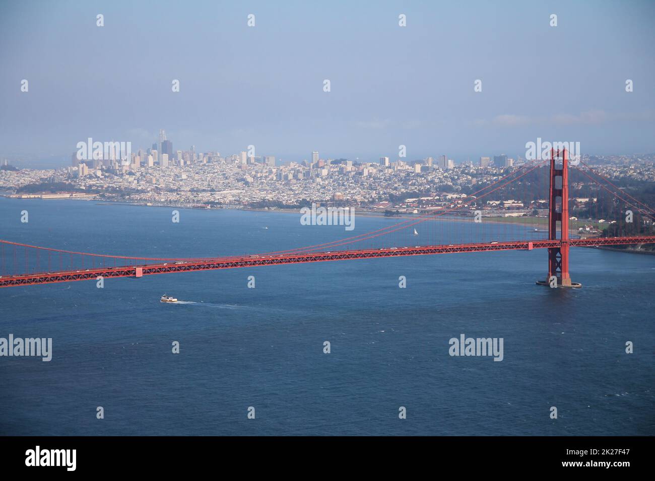 The beauty of San Francisco behind the red Golden Gate bridge in a ...