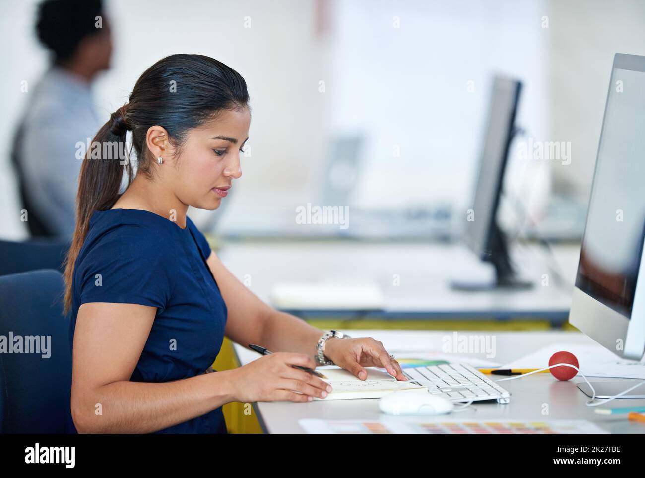 Analog beginnings for her design. an attractive young designer sitting ...