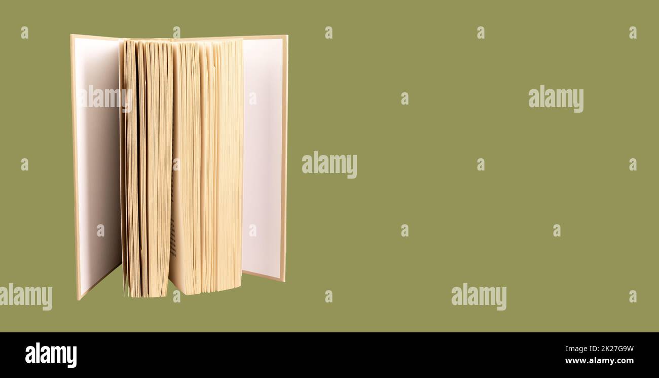 Book on green background. Turning pages. Eco style. Encyclopedia, novel ...