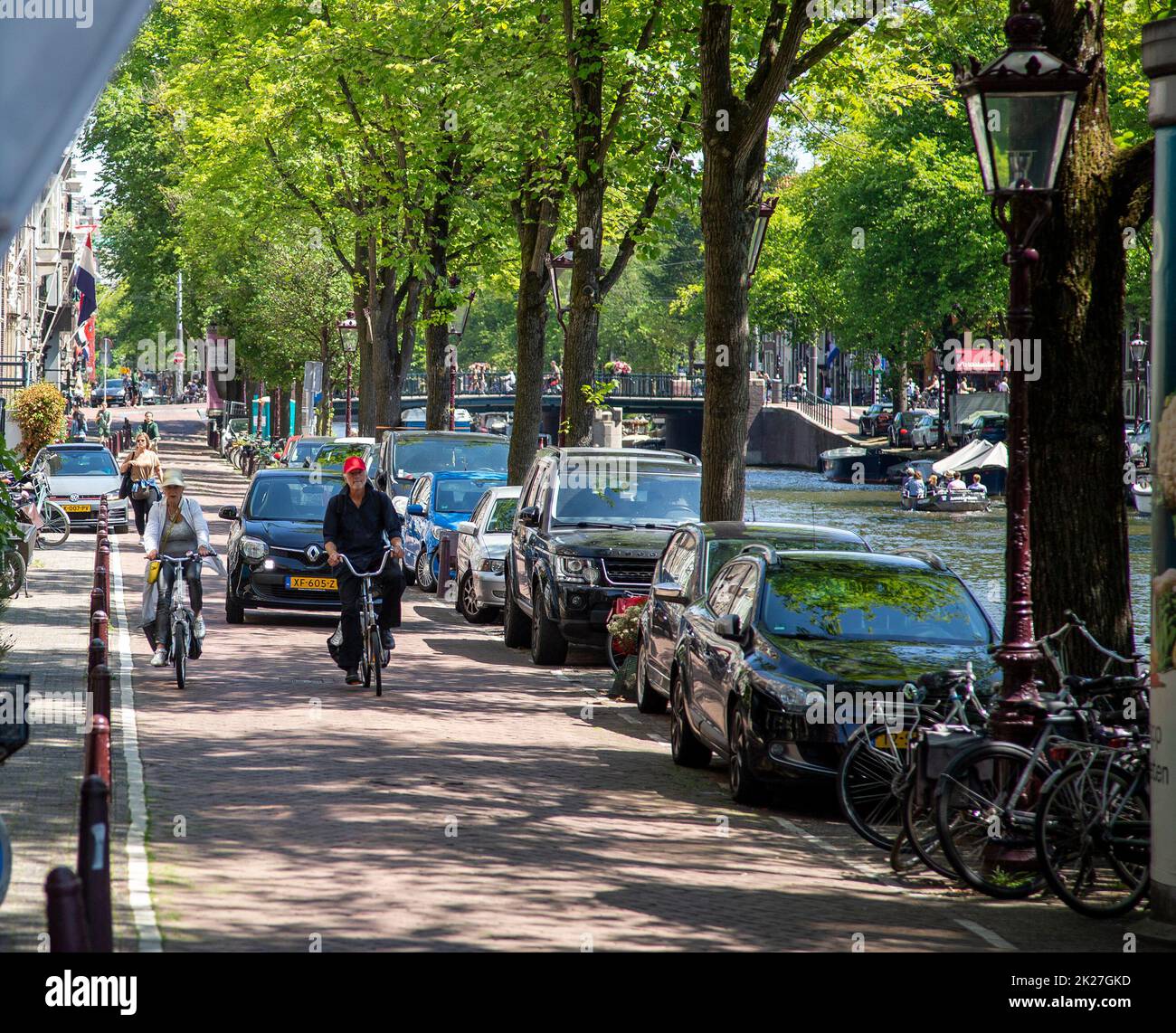 Bike riders on an Amsterdam stree Stock Photo - Alamy