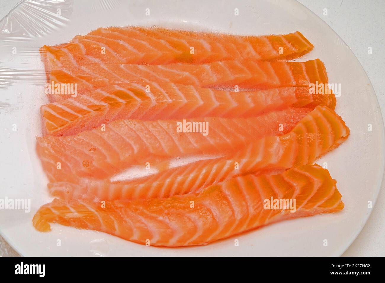 Fresh raw salmon strips Stock Photo - Alamy