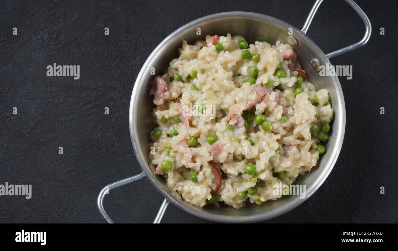 Classic italian risotto with peas, cheese parmesan, prosciutto. Risi e ...