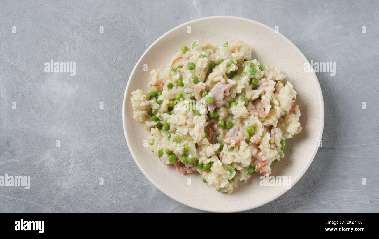 Classic italian risotto with peas, cheese parmesan, prosciutto. Risi e ...