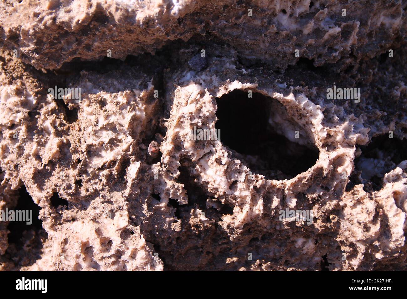 The hole on the salt and rock formation of the Devils Golf Course in ...