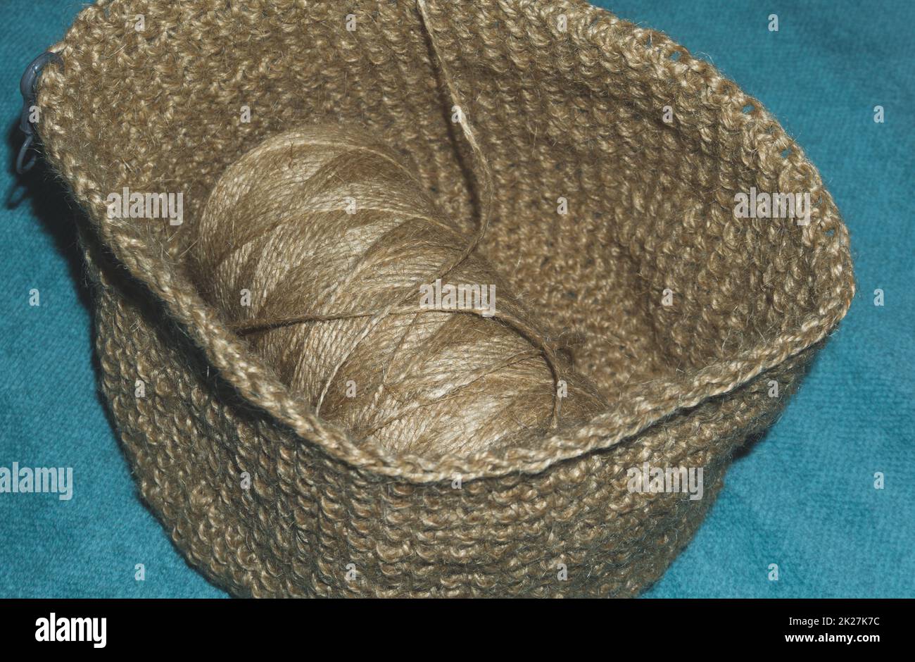 Jute needlework. handmade knitted basket. crocheting process Stock ...