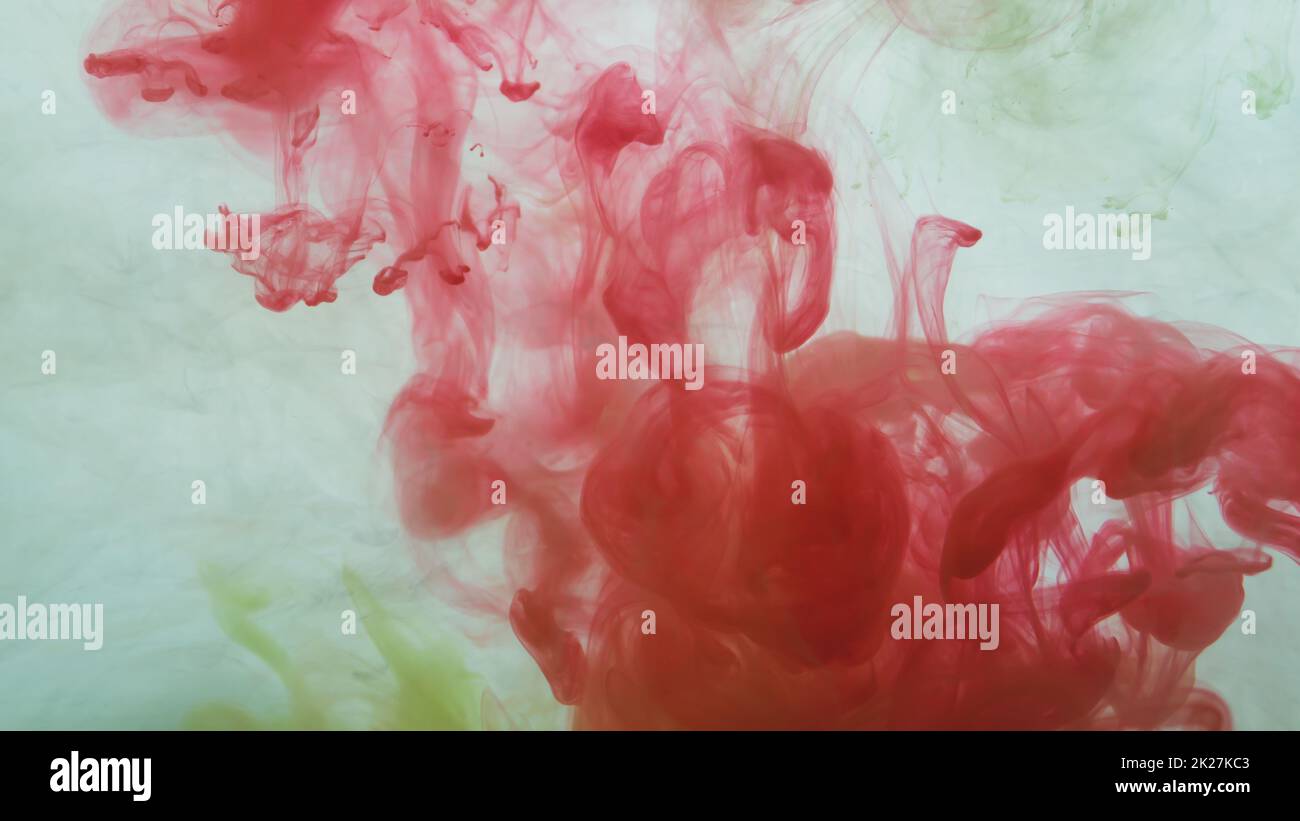 Red paint in the water. abstract background. ink in fluid. colorful ...