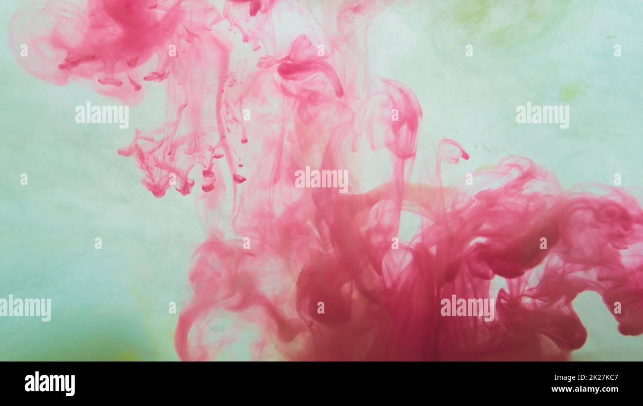 Red paint in the water. abstract background. ink in fluid. colorful ...