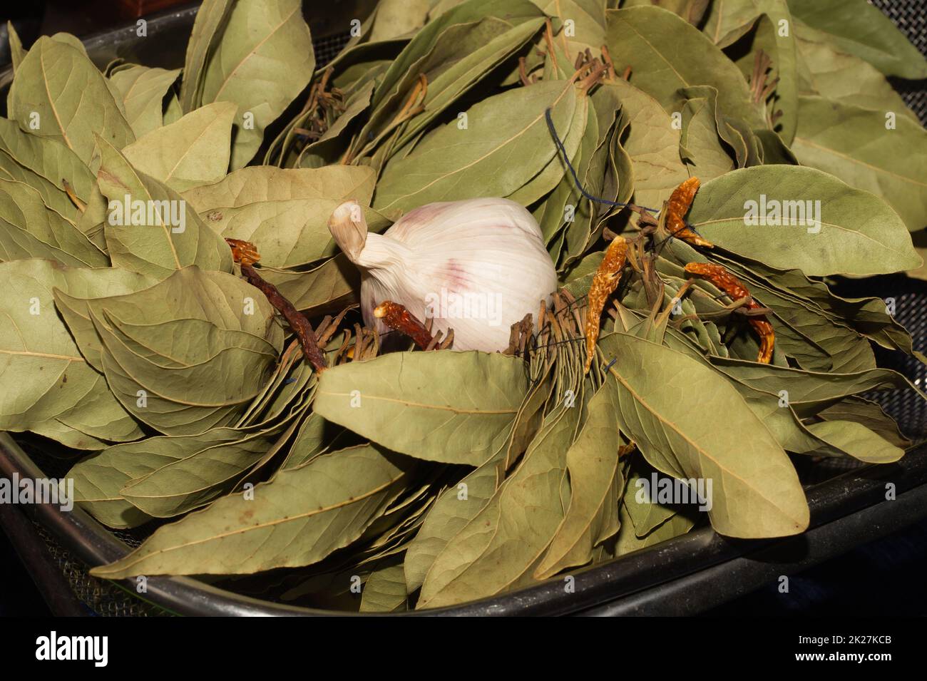 Garlic and bay leaves. dried hot peppers Stock Photo - Alamy