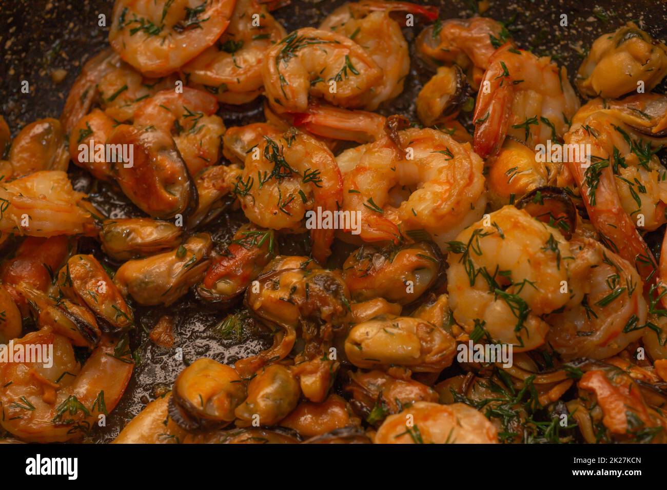 Fried prawns and mussels. grilled seafood close up Stock Photo - Alamy