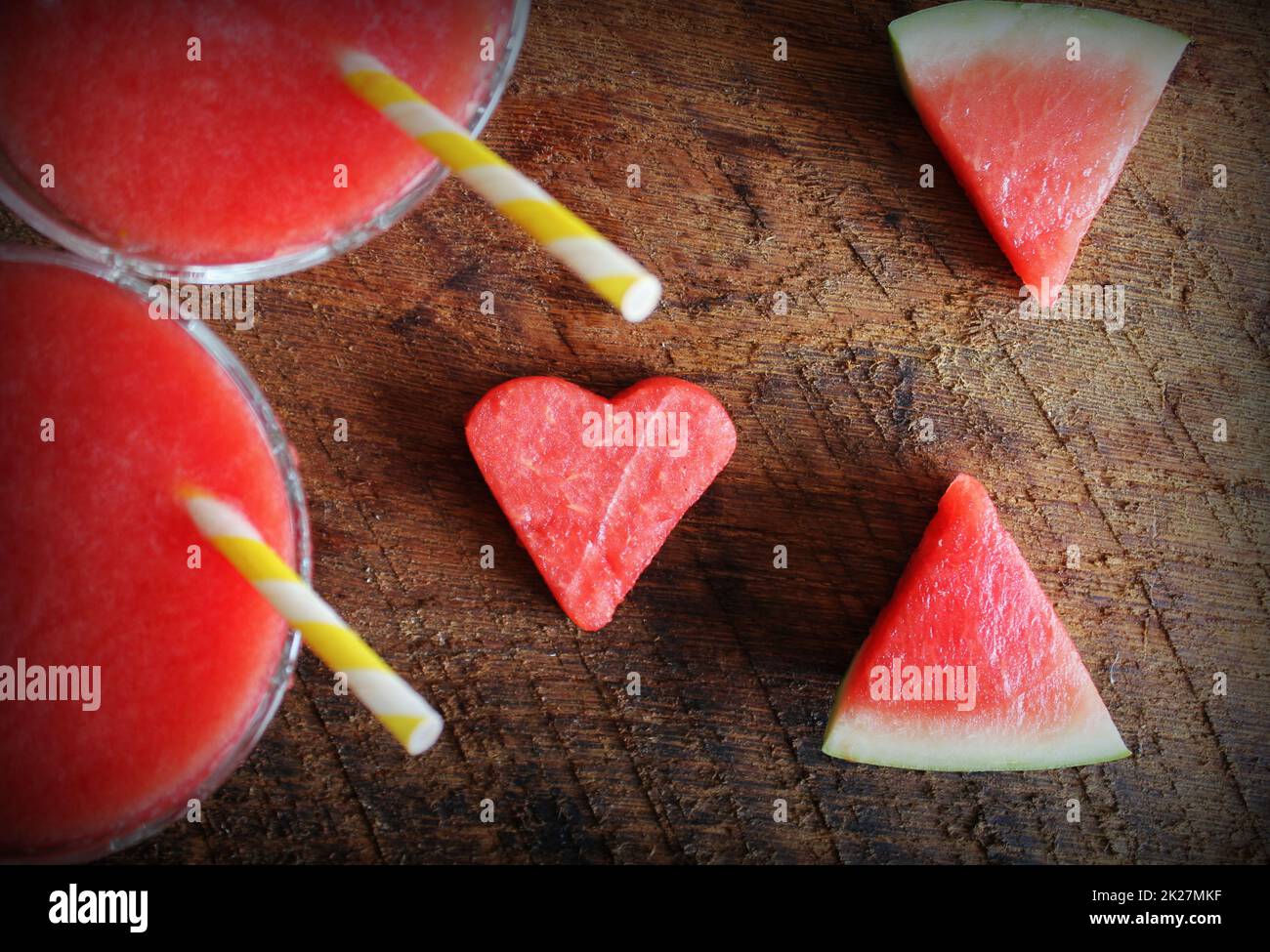 Healthy watermelon smoothie with of watermelon in heart shape on a wood ...