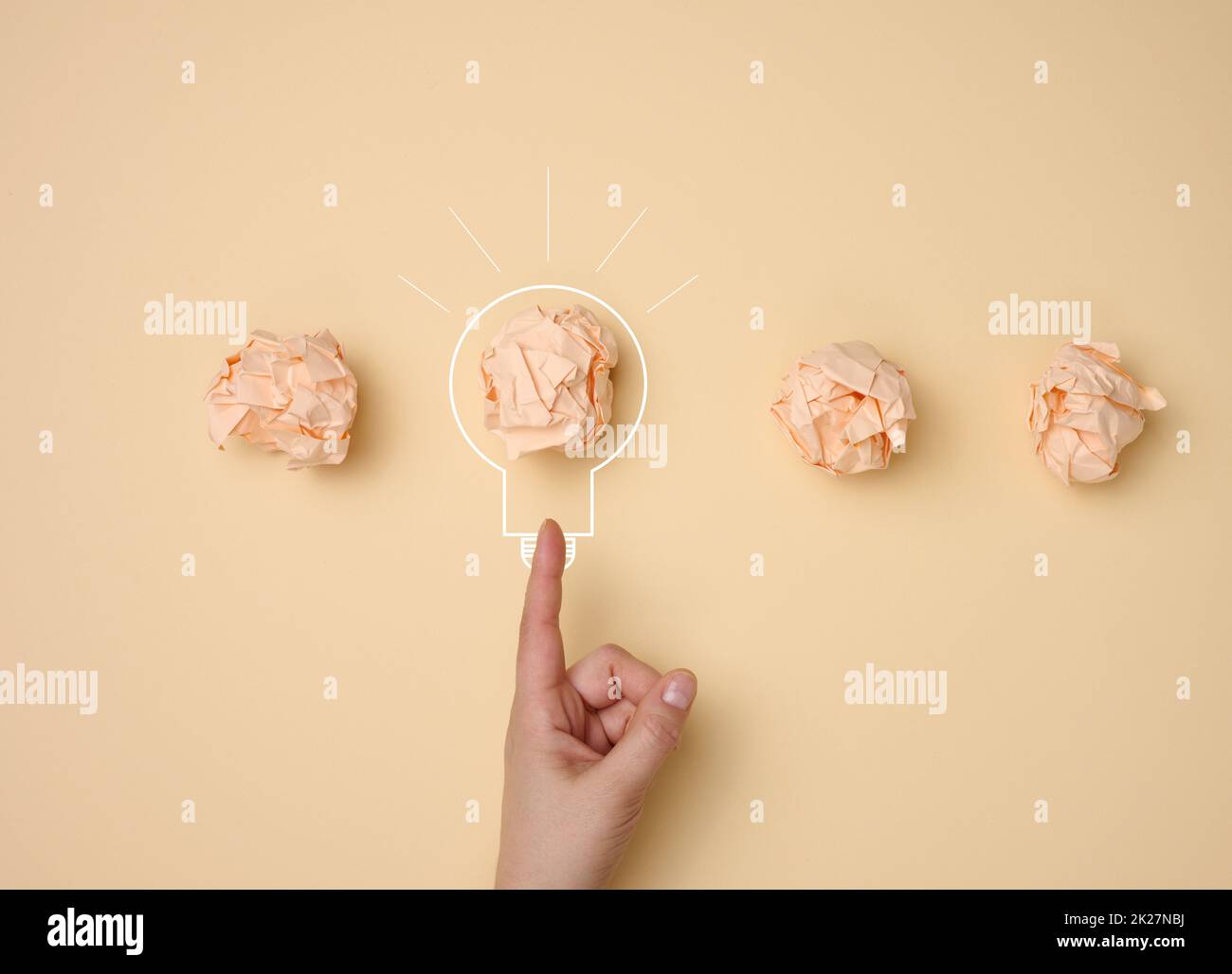 a female hand points to crumpled sheets of paper, a drawn electric ...