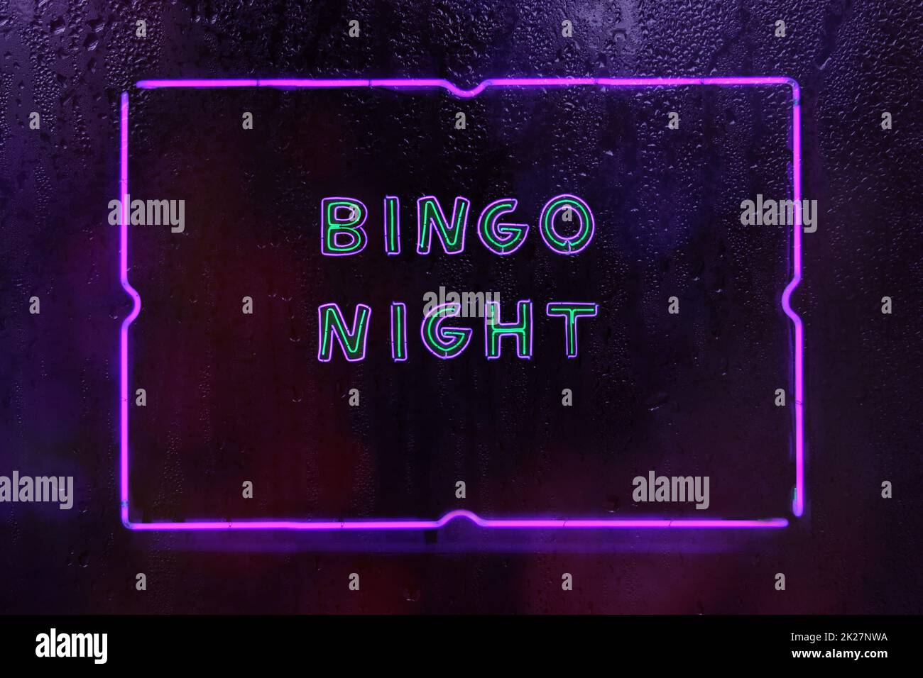Neon Bingo Night Sign in Rainy Window Stock Photo - Alamy