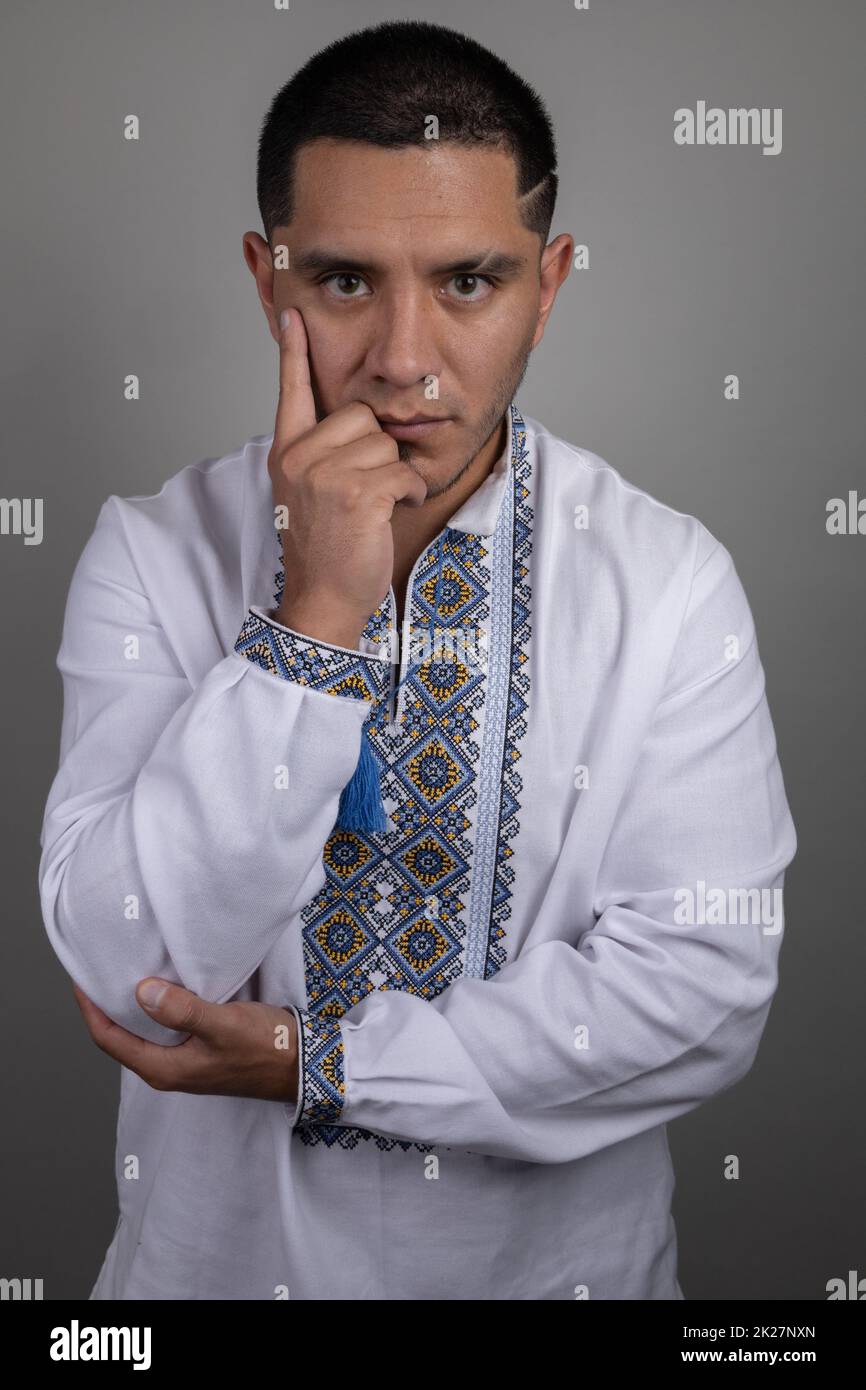 young man looking at the camera with an intimidating look while ...