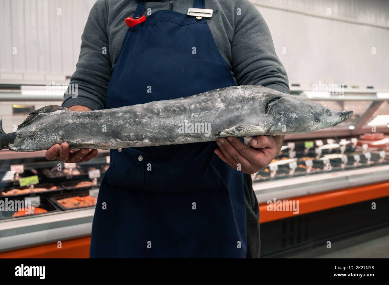 Male fishmonger or fish market worker Stock Photo - Alamy