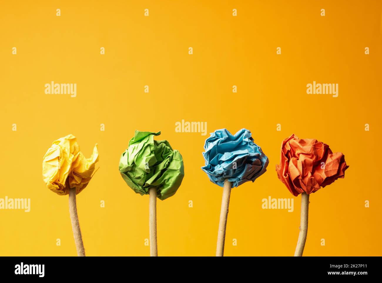 Four flower stems with colorful paper balls as flowers Stock Photo - Alamy