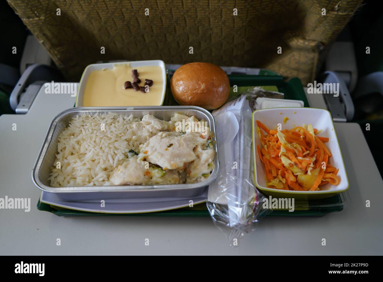 Airplane food, rice and chicken meat with carrot vegetable salad, on ...