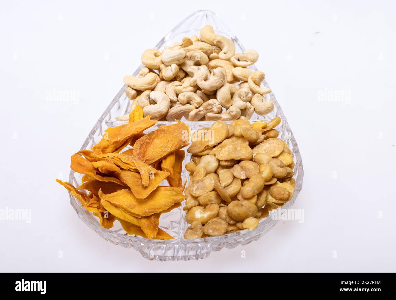 Roasted and salted fava beans, cashew nuts and dried mango slices Stock ...