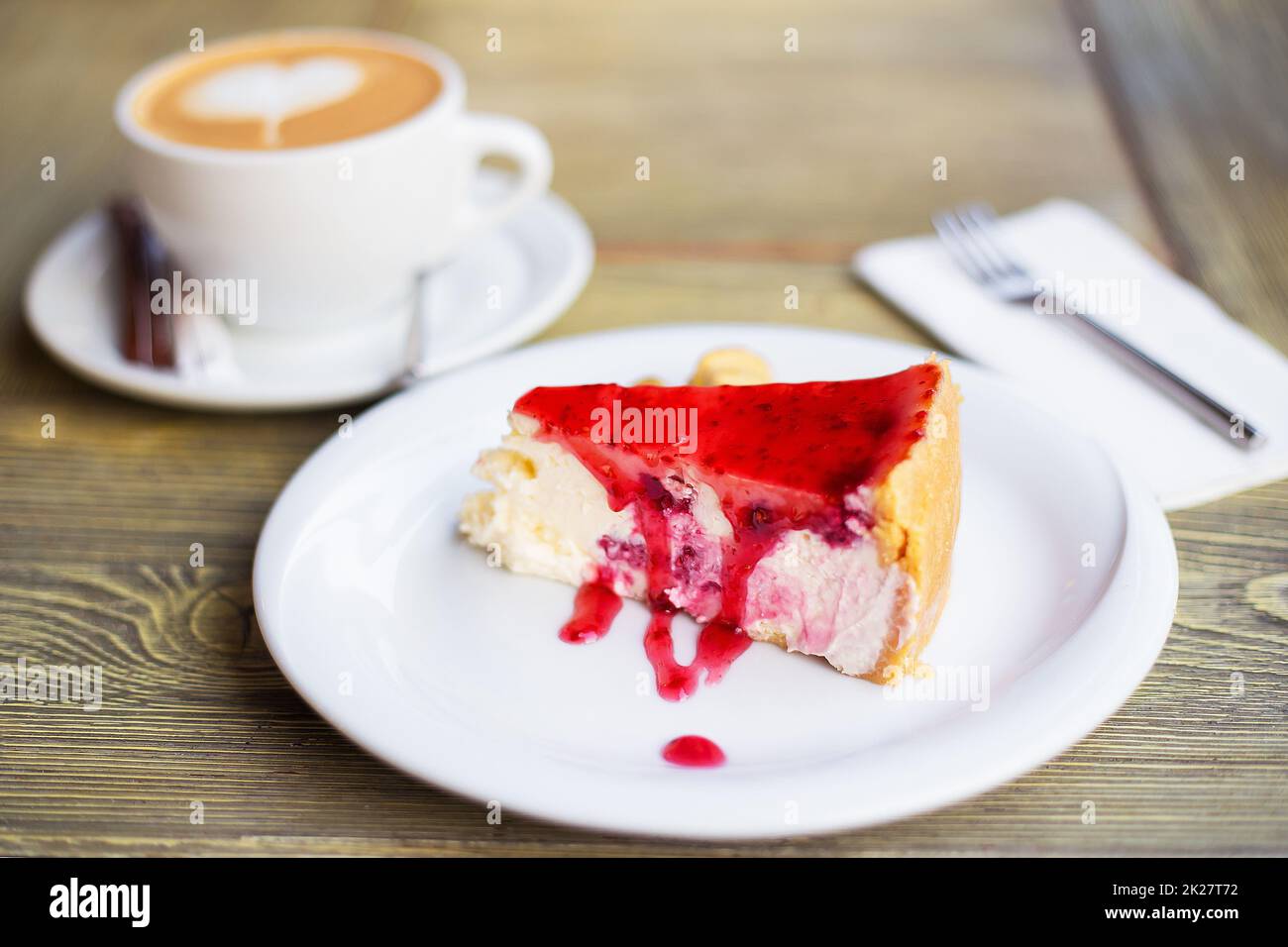 Delicious and beautiful cheesecake with strawberry jam Stock Photo - Alamy