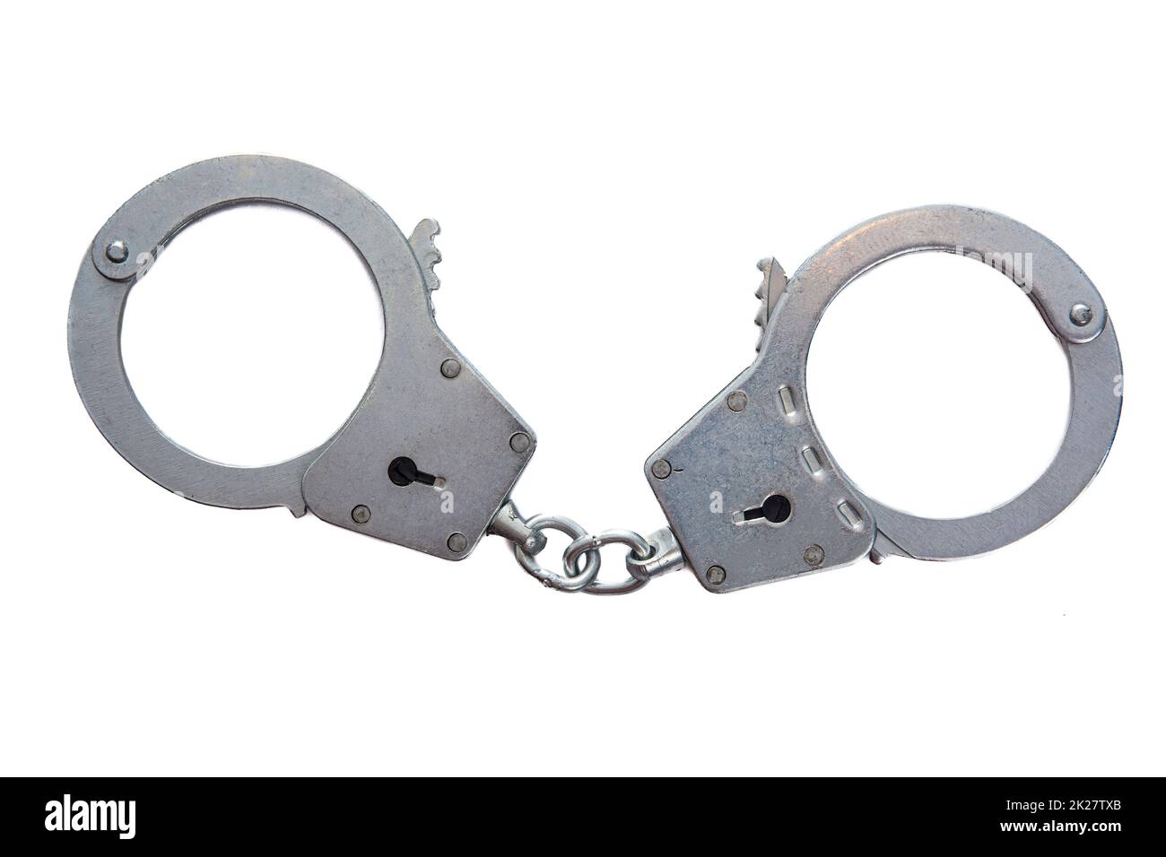 Metal handcuffs on a white isolated background Stock Photo - Alamy