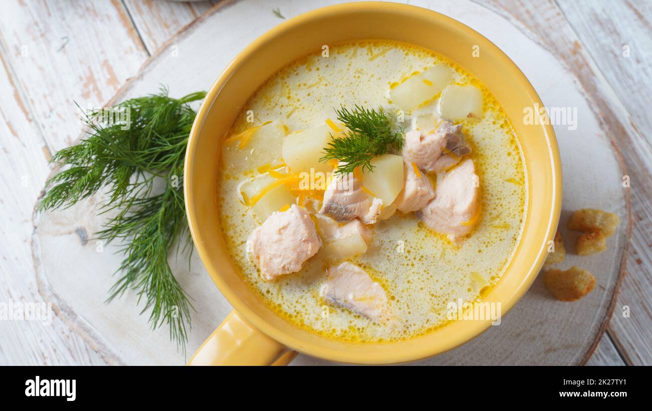 Creamy fish soup with salmon, potatoes, onions , carrots, dill and ...