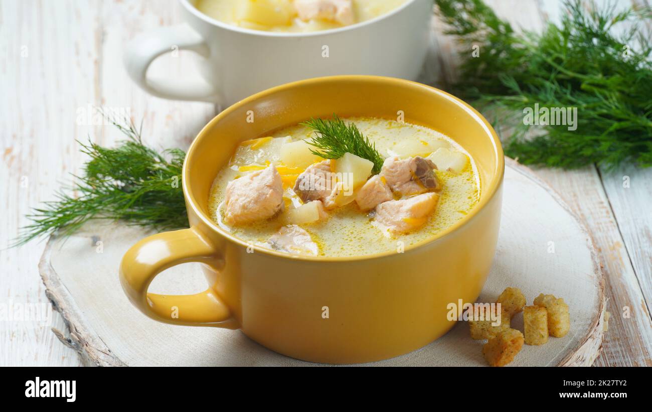 Creamy fish soup with salmon, potatoes, onions , carrots, dill and ...