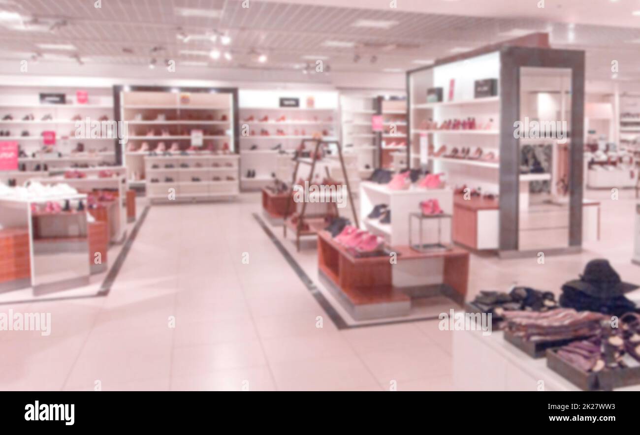 abstract blur vintage style clothing store displaying woman's fashion ...