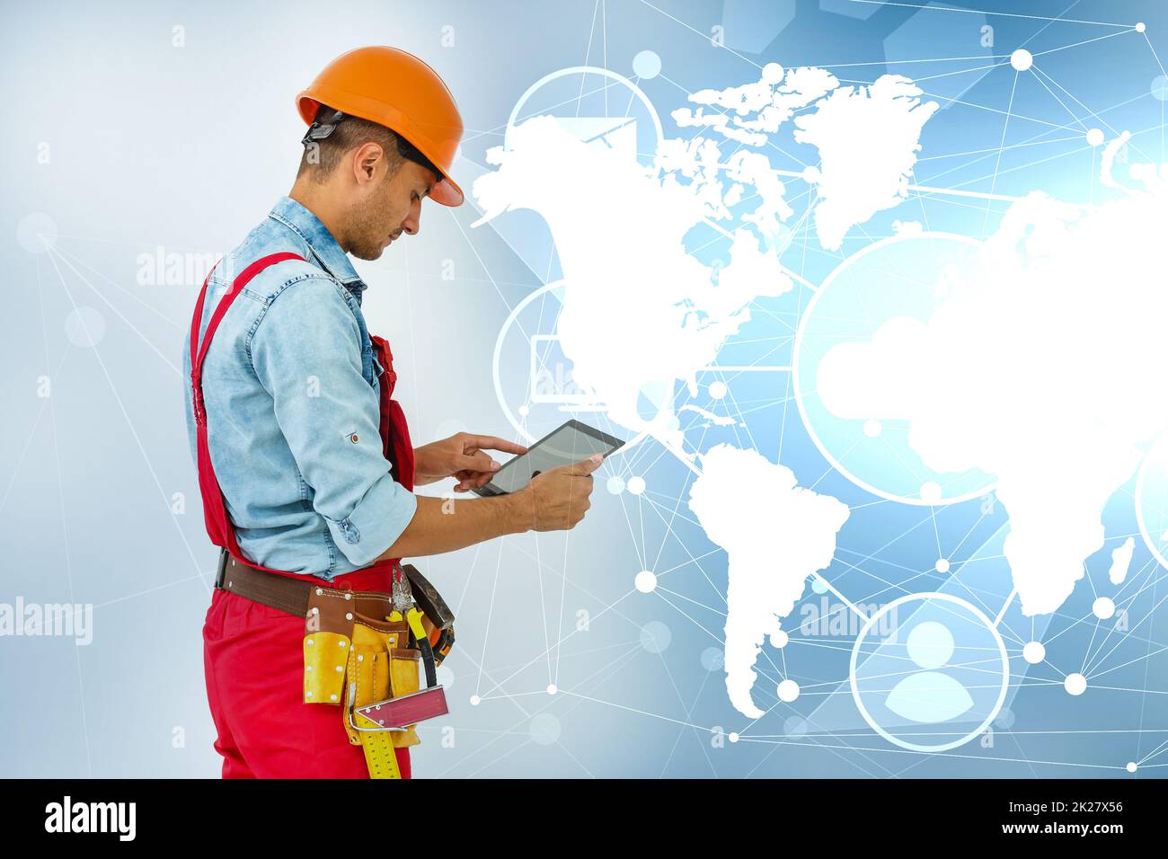 Side view man engineer wearing protective helmet using a tablet ...