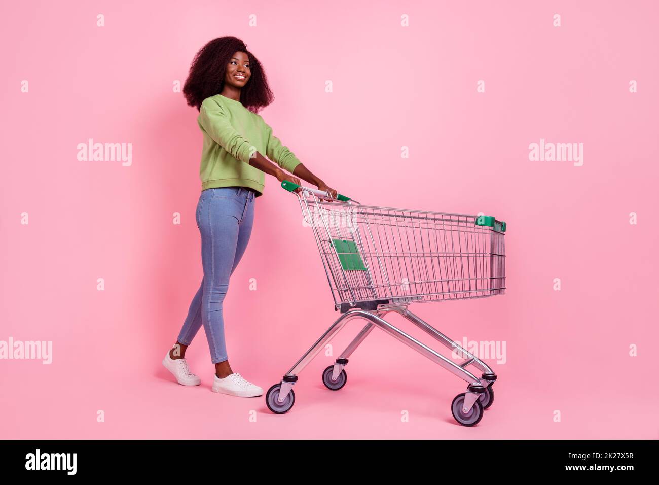 Full length photo of dreamy pretty lady wear green sweater walking ...
