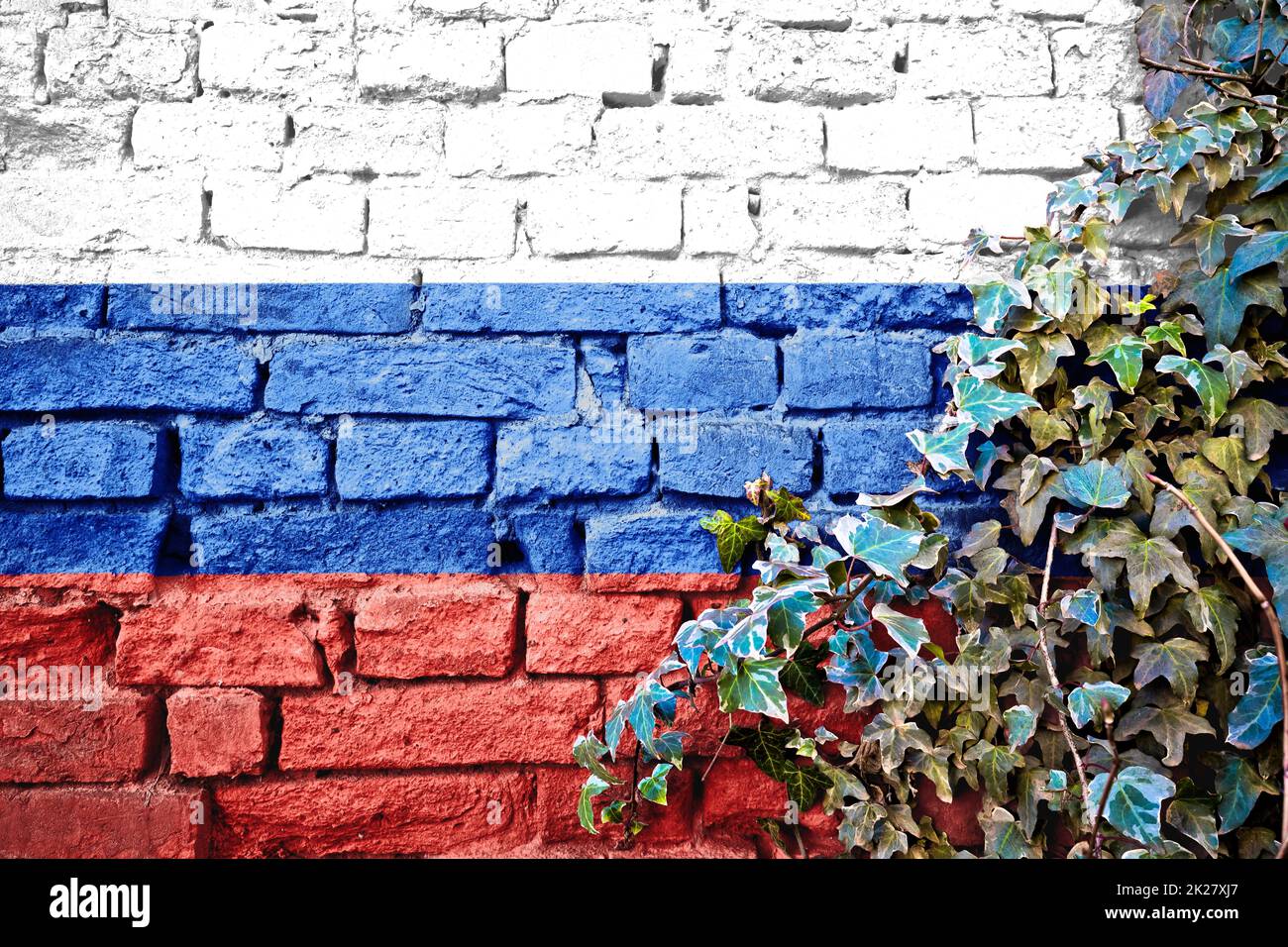 Russian grunge flag on brick wall with ivy plant Stock Photo - Alamy