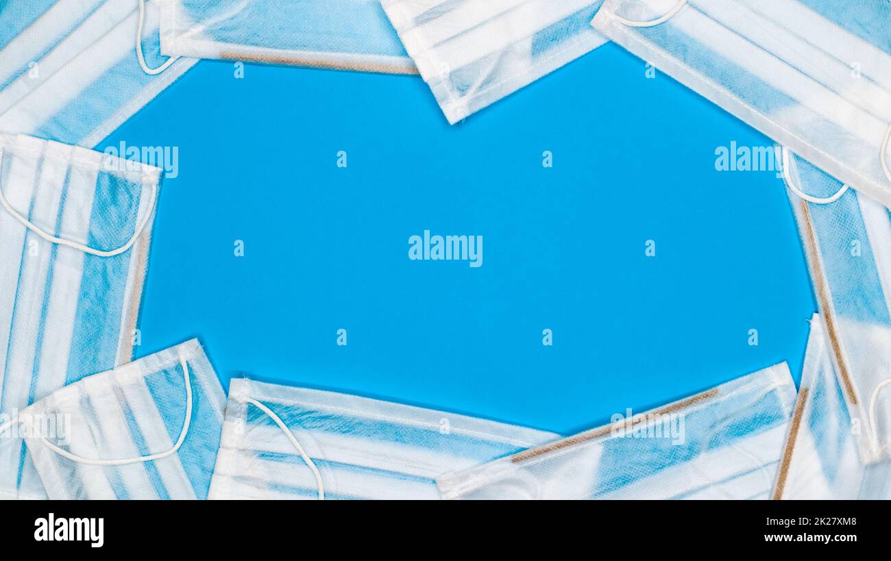 Many antiviral protective medical face masks with earloops are set ...