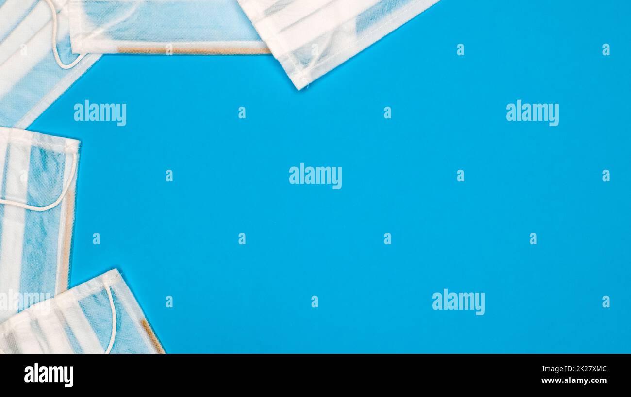 Many antiviral protective medical face masks with earloops are set ...