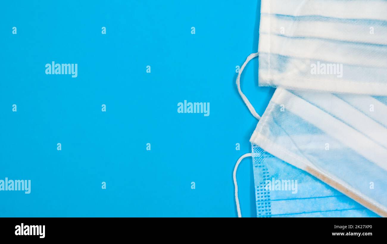 Three disposable surgical face masks with rubber pads to cover the ...