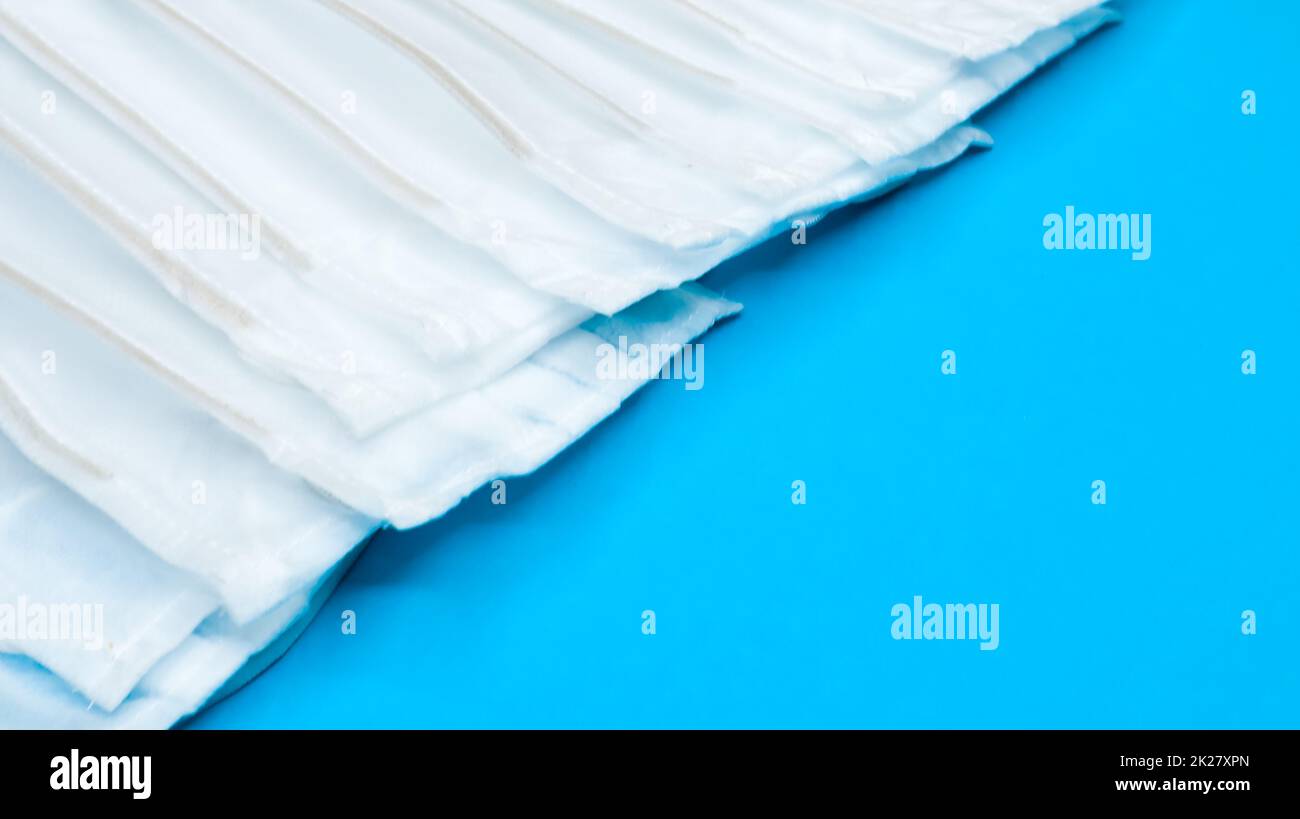 Many antiviral protective medical face masks with earloops are set ...