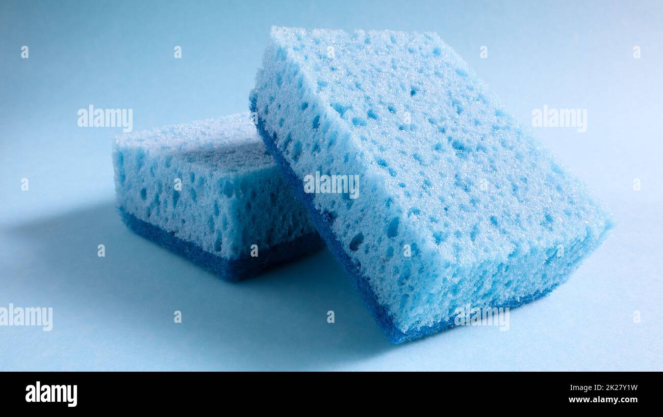 Two blue sponges used for washing and erasing dirt used by housewives ...
