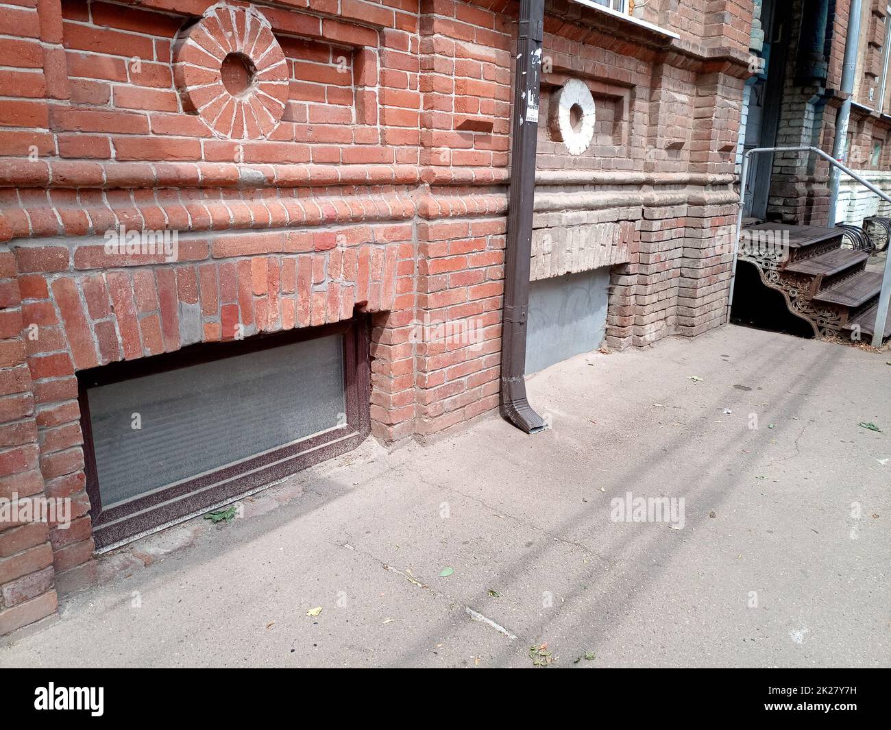 upper part of the window of the ground floor of the building. Recessed ...