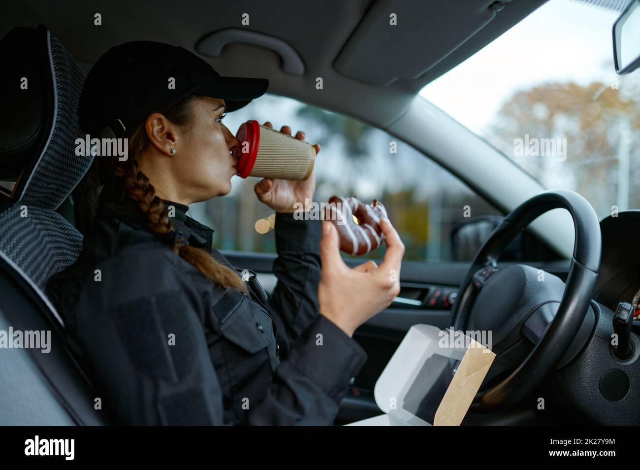 Female police officer having lunch during workday Stock Photo - Alamy