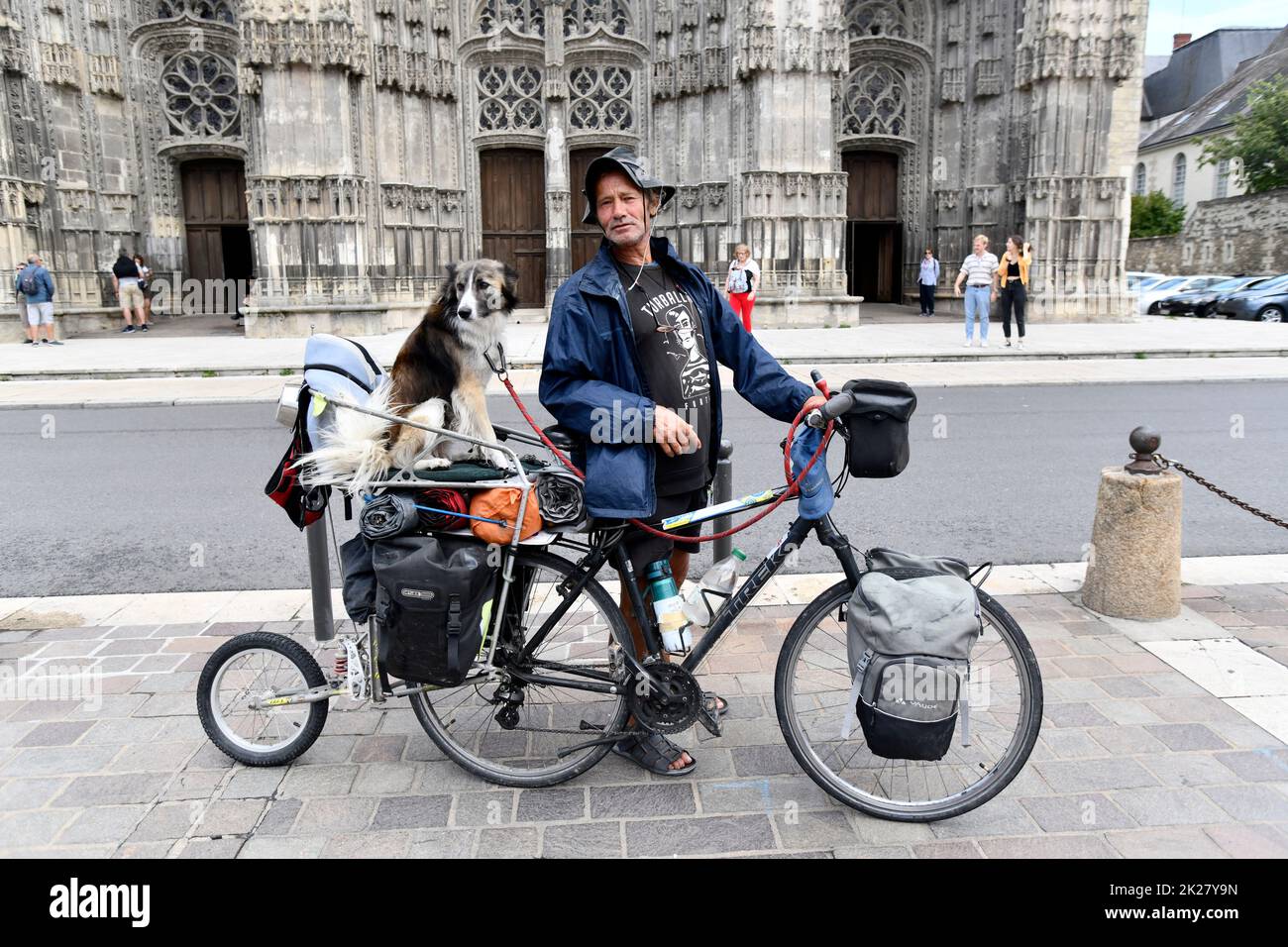 Man travelling around the city of Tours in France on his bycycle with ...