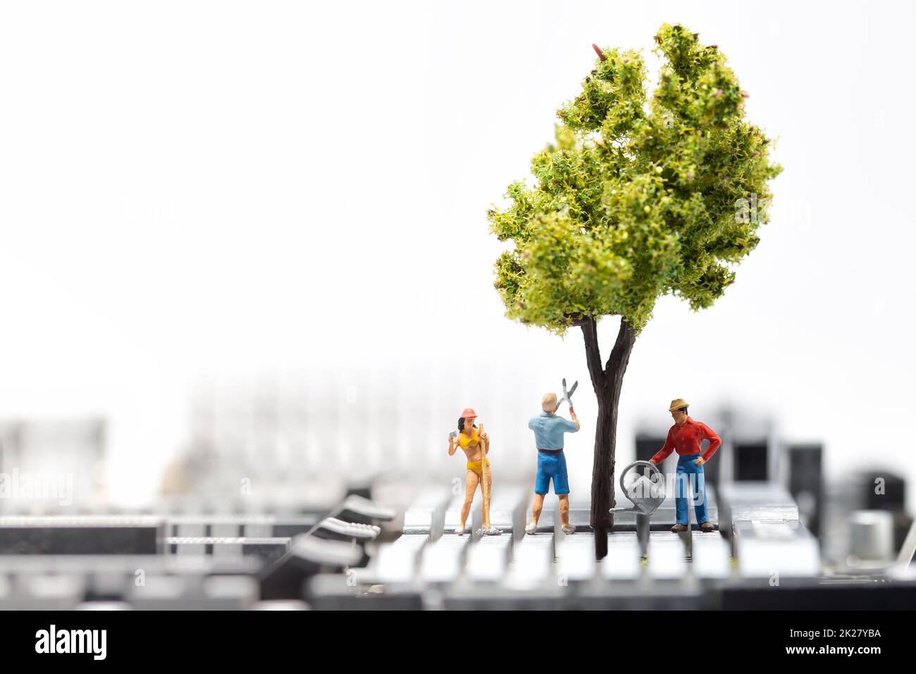 Group of people growing a tree on circuit board. Green environment ...