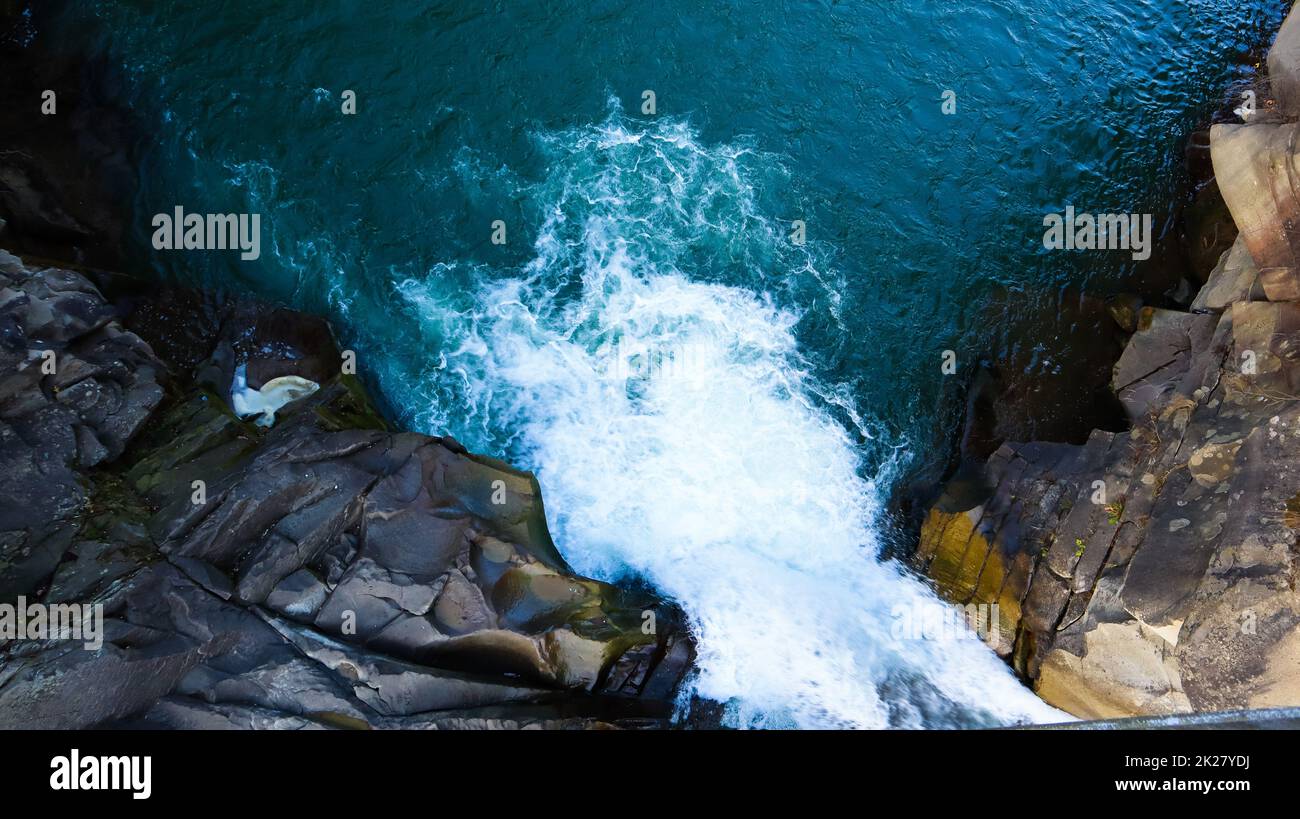 Waterfall from top to bottom. Top view of the stream, water flows over ...