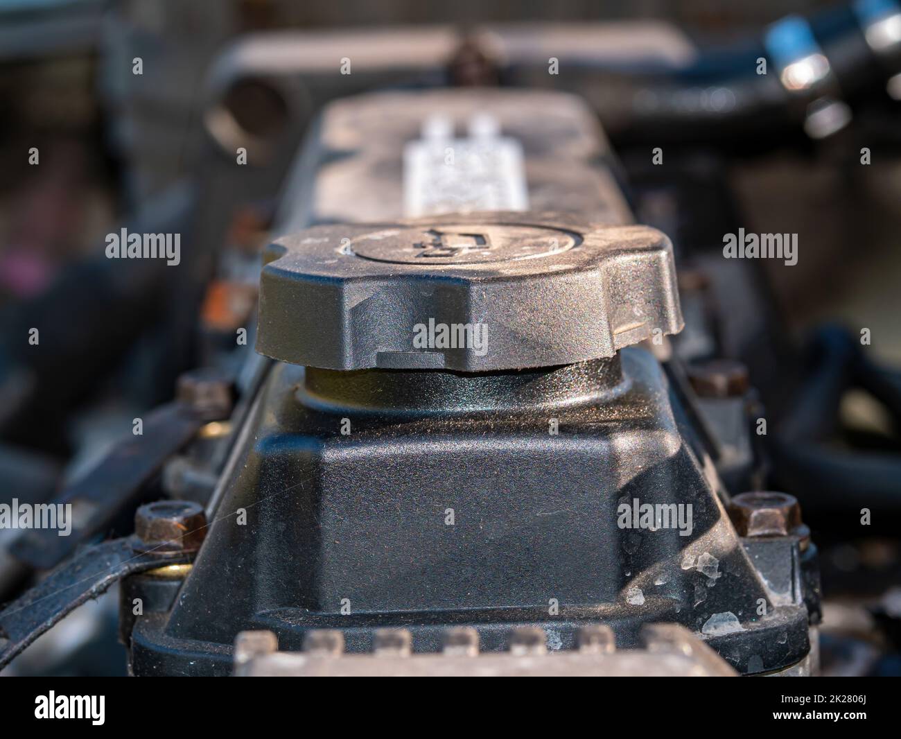 Filler cap for filling engine oil into a car engine Stock Photo - Alamy
