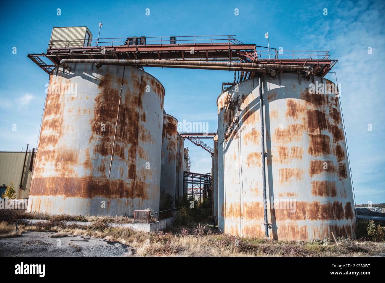 Storage tanks containing tailings from the mine site which were once ...