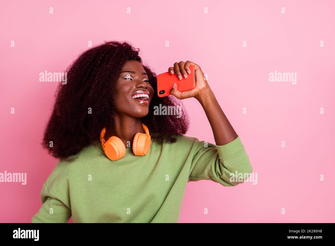 Photo of adorable sweet lady wear green sweater earphones singing mic ...