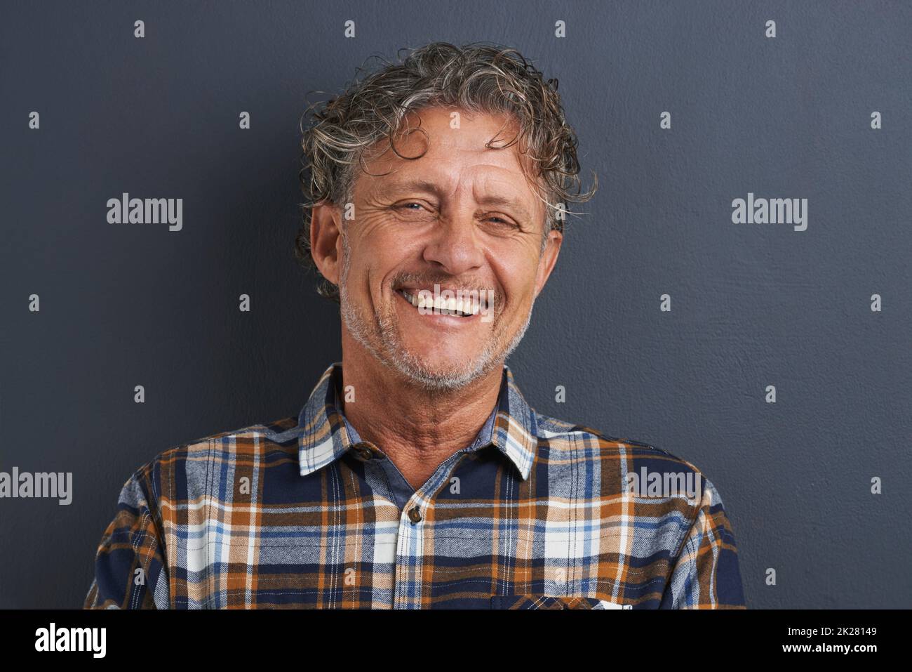 Laughter is the language of the soul. A cropped portrait of a handsome ...