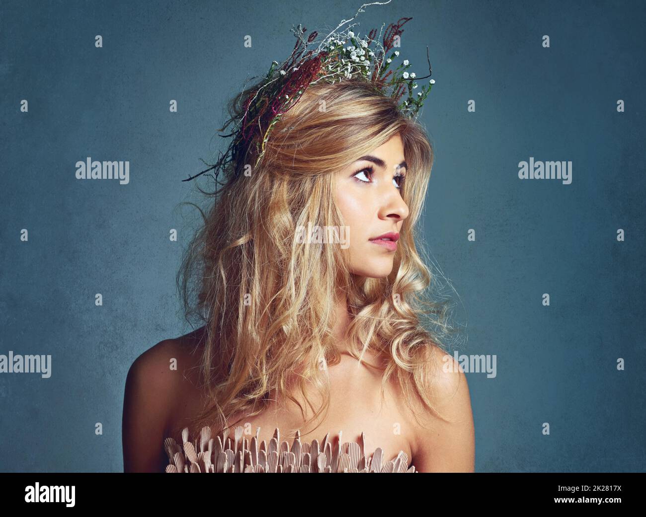 Beauty inspired by nature. a young woman posing with flowers in her ...